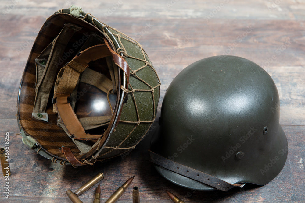German and U.S World War Two military helmets, battle of Normandy 1944 ...