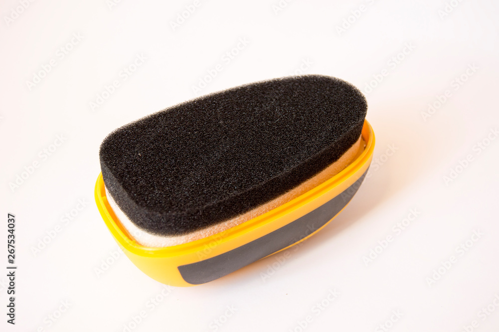 Black shoe shine sponge with yellow line on white background. Stock ...