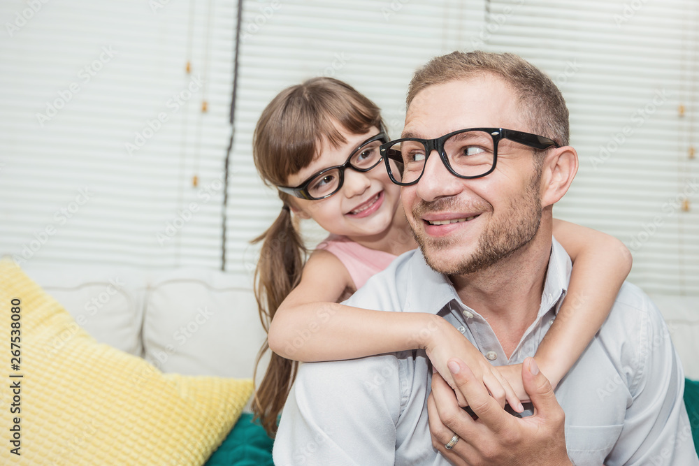Portrait of nerd caucasian father daughter wearing glasses smiling ...