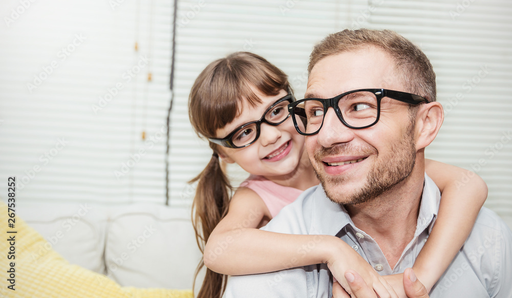 Portrait of nerd caucasian father daughter wearing glasses hugging and ...