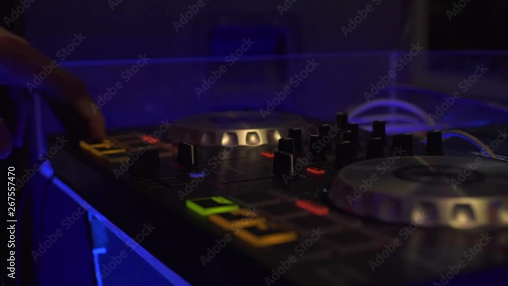 Vídeo do Stock: DJ console for mixing dance music and colorful light in ...