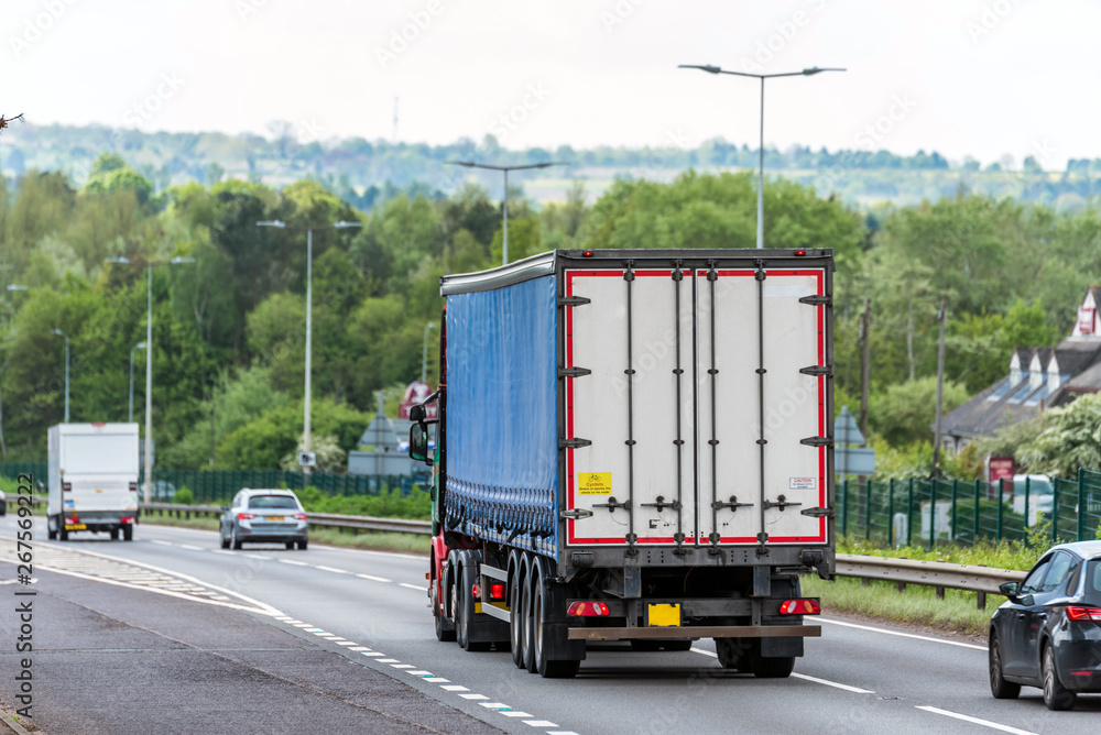 curtain side lorry truck on uk motorway in fast motion Stock Photo ...
