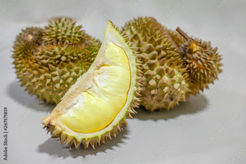 Hand peeling durian shell by knife. The durian is a king of fruit and ...