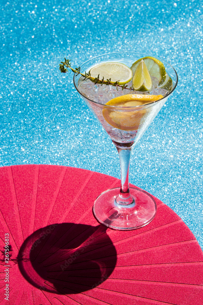 Elegant cocktail on colorful divided background. Abstract conception ...