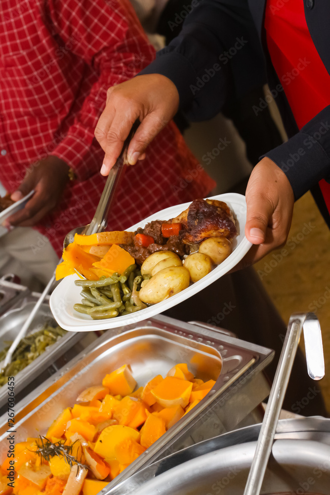 people being served food at a table by waiter up close Stock Photo ...