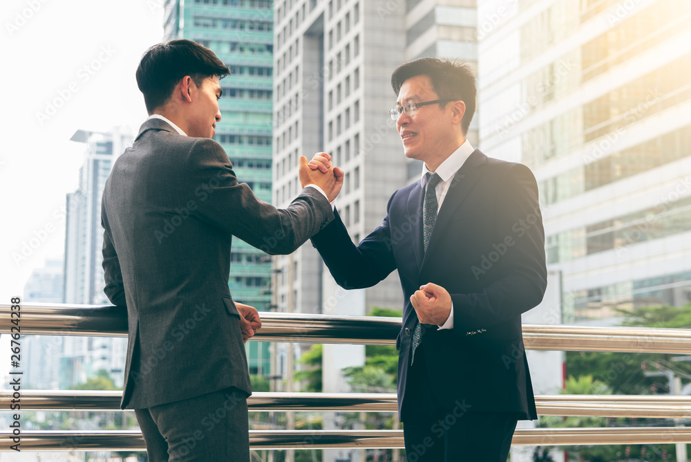 Male businessmen coordinate showing the power And cooperate In doing ...