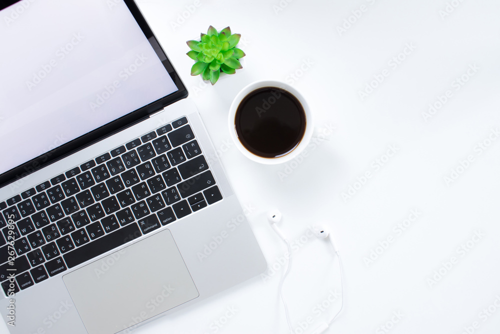 Top view of laptop computer with white screen on modern white desk ...