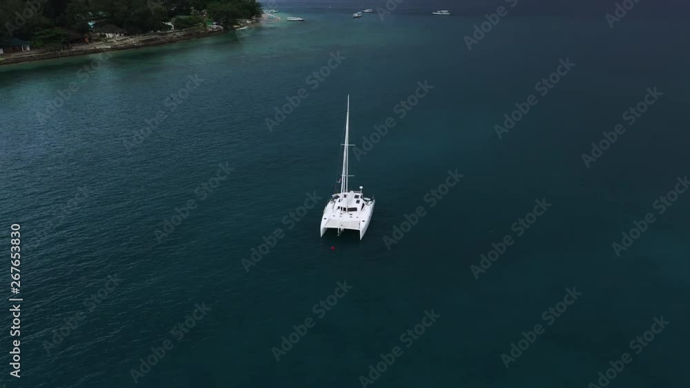 HIGHT angle shot, top view of the boat. Aerial View of a Anchored ...