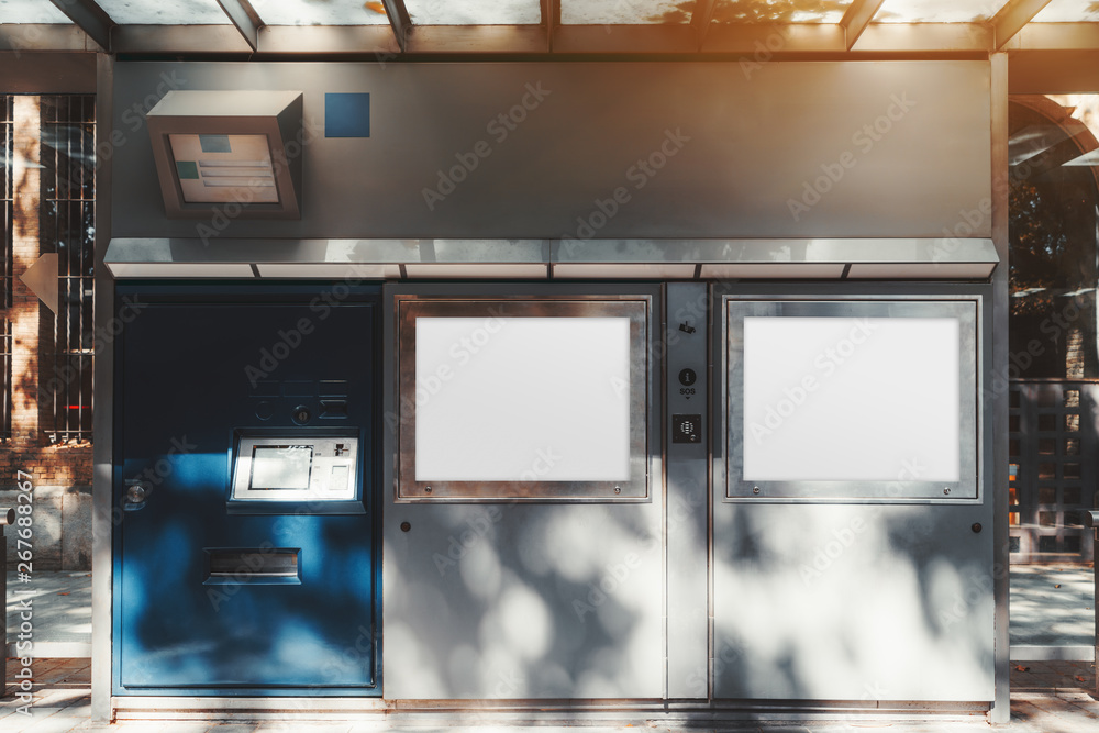 A modern outdoor public covered transport stop with ticket payment self ...