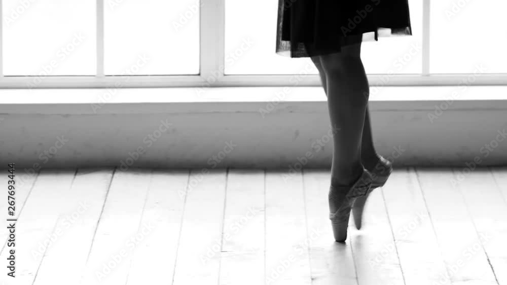 Ballerina legs wearing dancing shoe. Ballerina going on tiptoes in ...