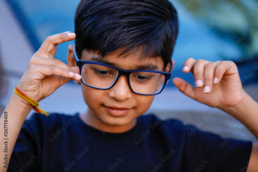 Cute Indian child wear eyeglass Stock Photo | Adobe Stock