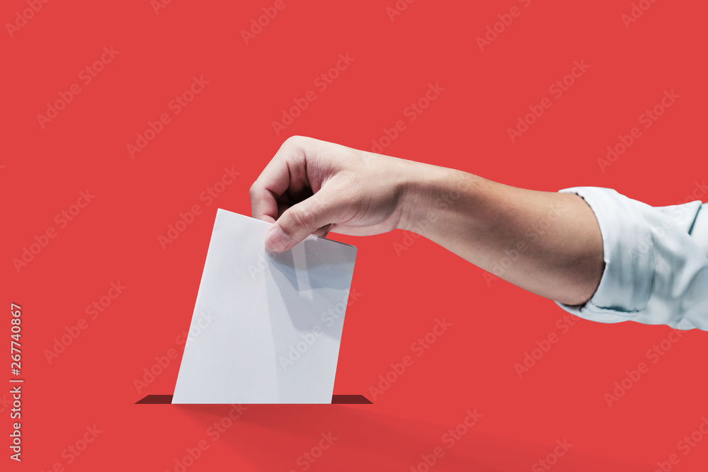 Hand holding ballot paper for election vote concept, clipping path ...