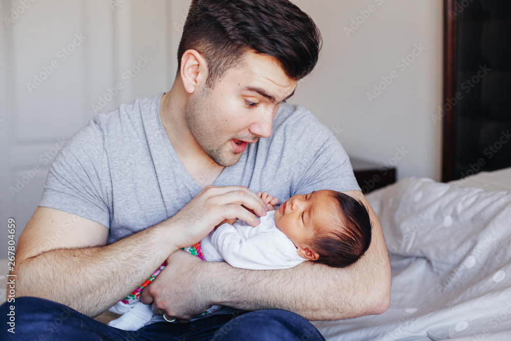 Young Caucasian father dad with his newborn mixed race Asian Chinese ...