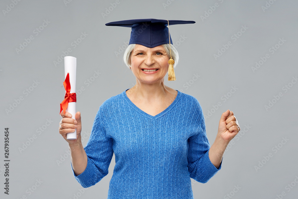 graduation, education and old people concept - happy senior graduate ...