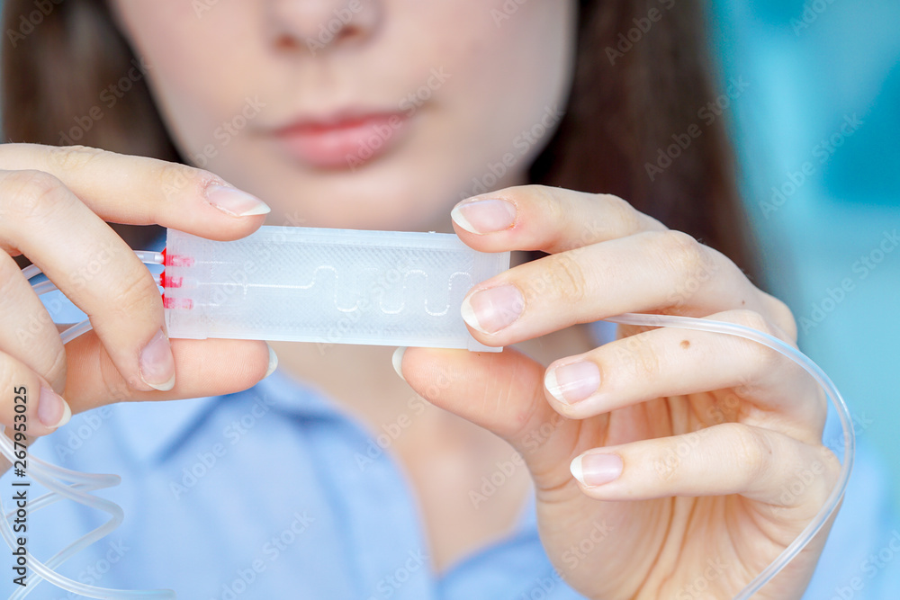 Girl holding polymers Bio-MEMS biomedical microelectromechanical ...