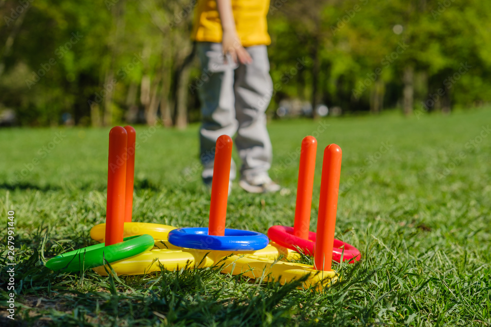 Ring throw summer game on a green lawn in the sun Stock Photo | Adobe Stock