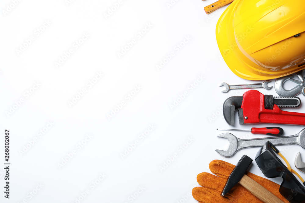 Composition with different construction tools on white background, top ...