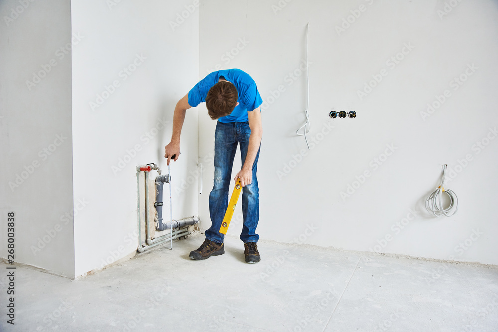 Plumbing in the house. Installation of sewer pipes in the kitchen of an ...