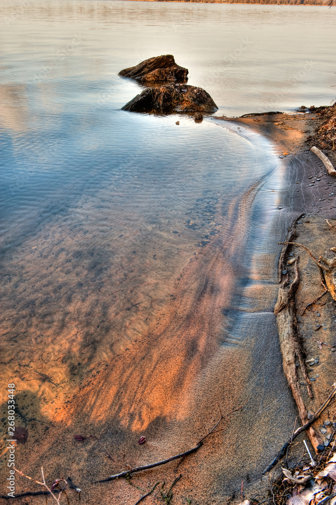 Sandy river bank with interesting sand ripples. Clean and clear water ...