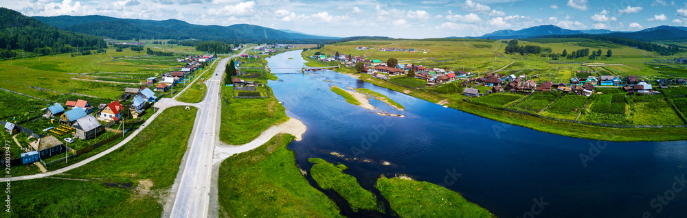 Aerial panorama of the river of Belaya with the villages on its green ...