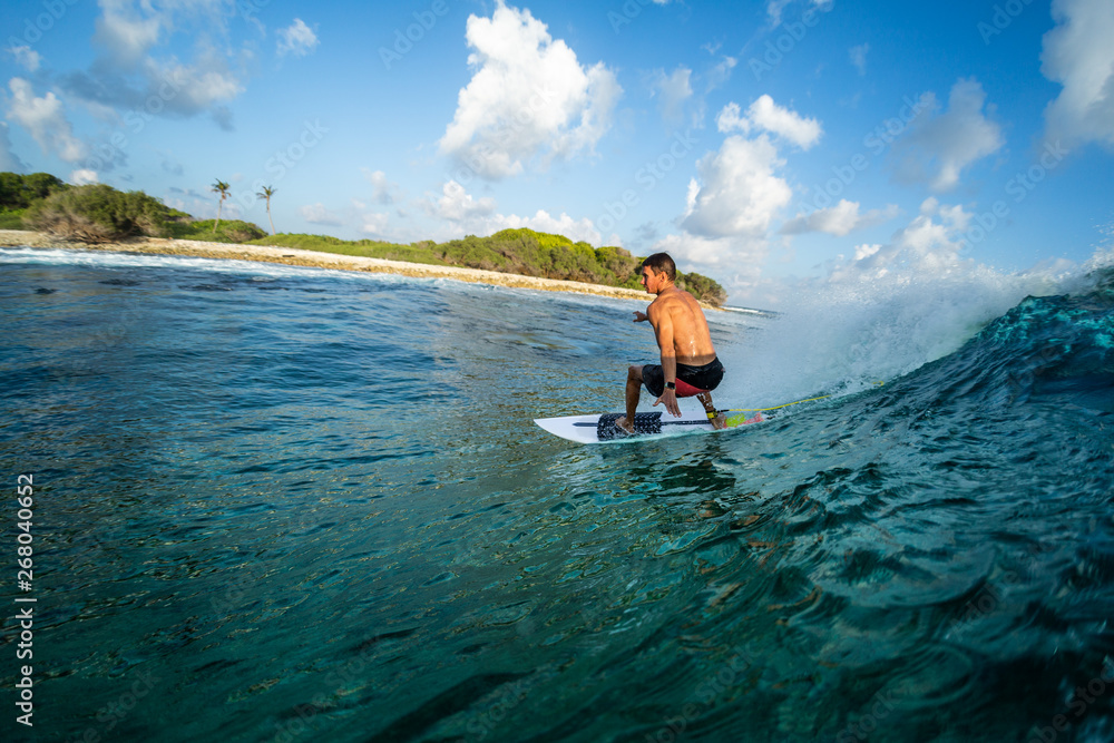 Surfer rides the ocean wave at sunset. Honkeys surf spot in the ...