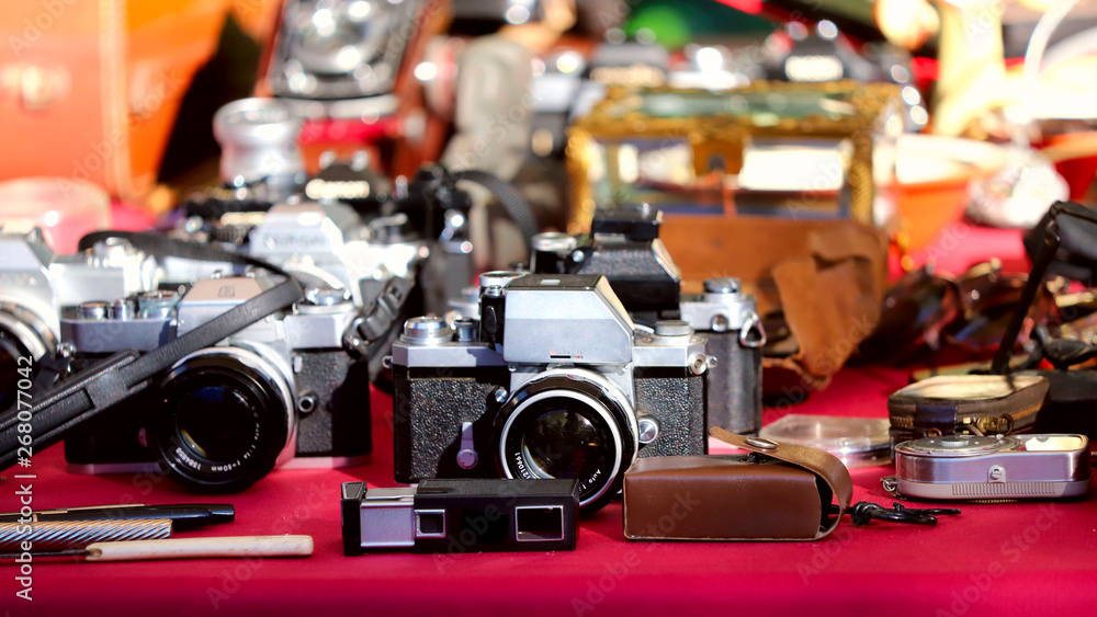 Fotka „Old models of cameras on the table at a flea market in Portugal ...