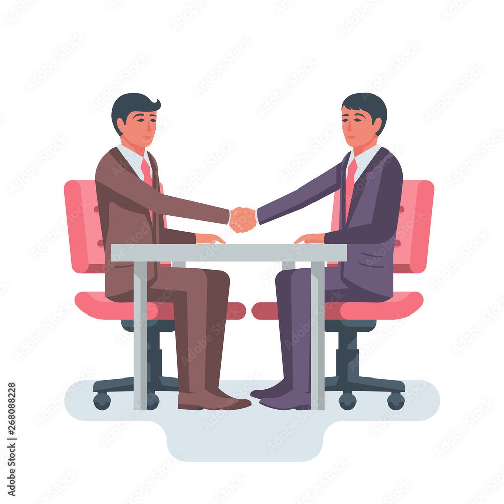 Handshake at the table. Beginning a business relationship. Two ...