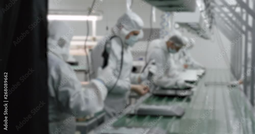 Blurred view of Innovative production of TVs, view of the assembly line ...