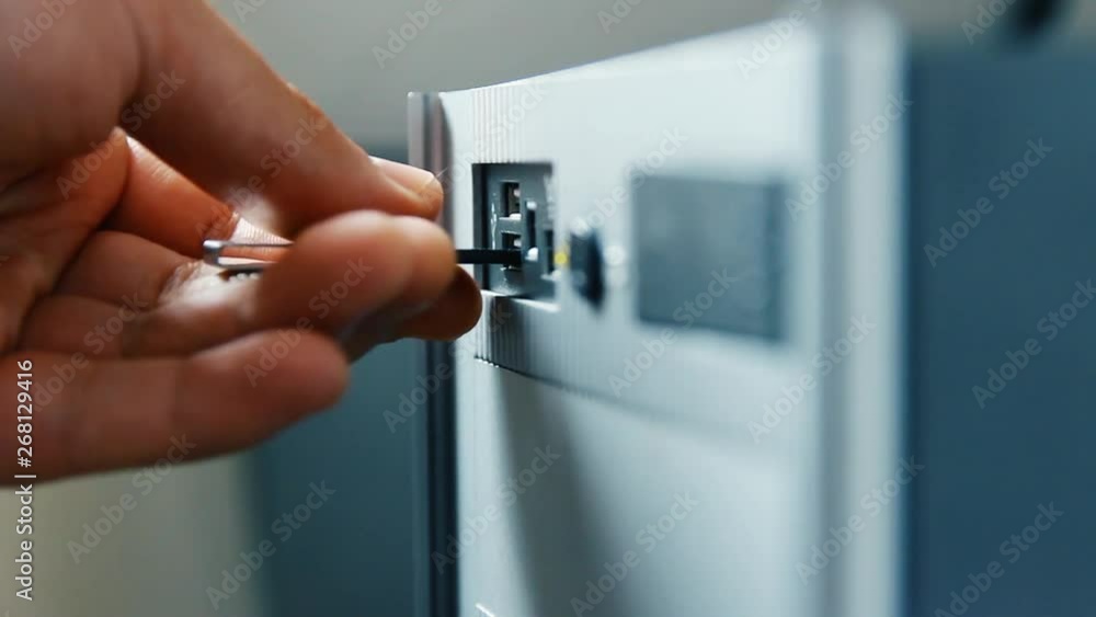 Manual insertion of the USB flash drive into the USB port of the ...