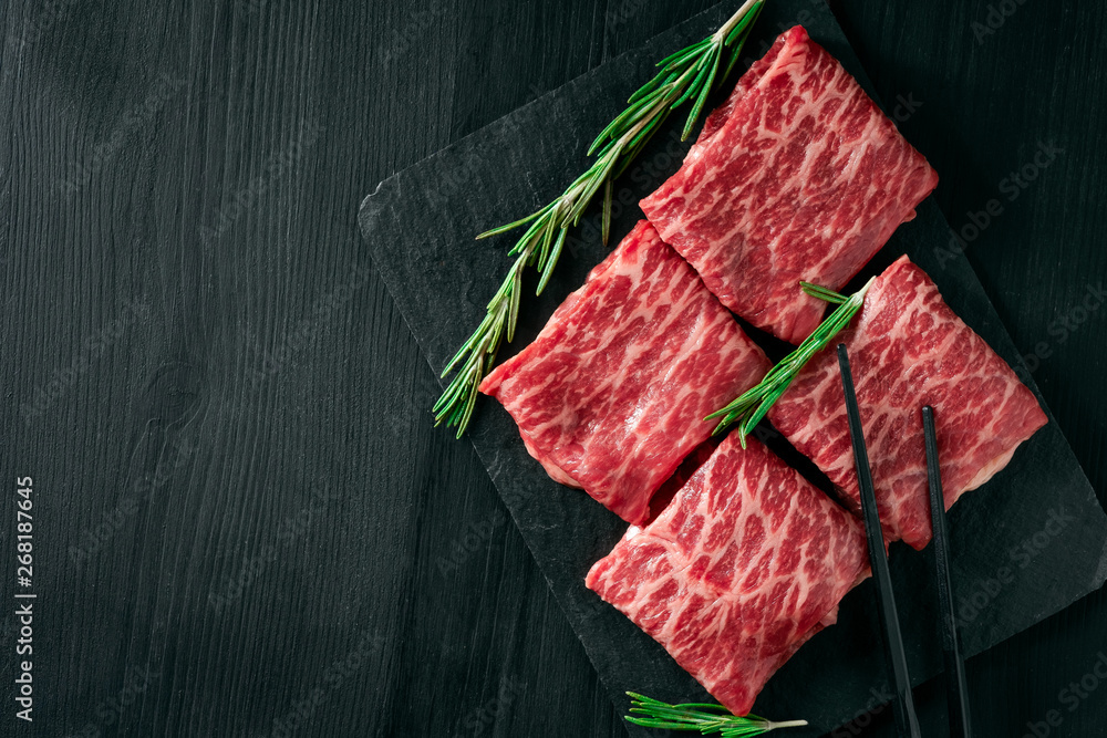 Zdjęcie Stock: Sliced wagyu marbled beef for yakiniku on plate on black ...
