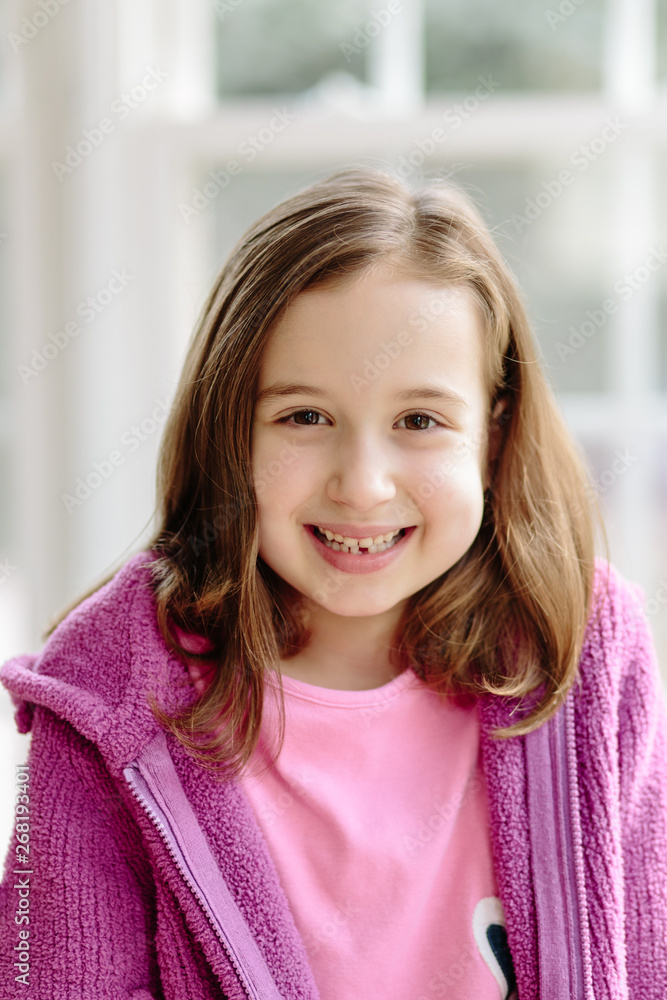 Beautiful young girl showing her first lost tooth Stock Photo | Adobe Stock