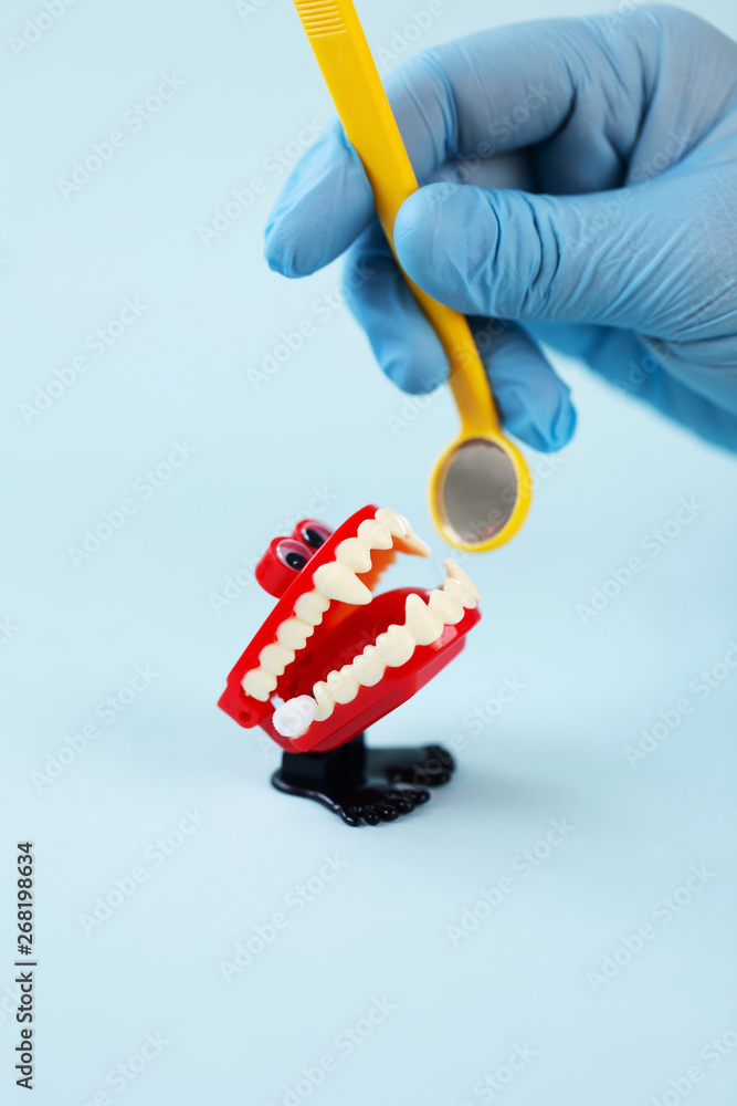 Dentist visits dracula chattering teeth with inspection mirror Stock ...