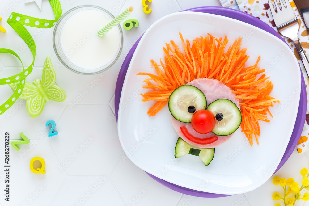 Fun food for kids - cute smiling clown face on ham sandwich decorated ...