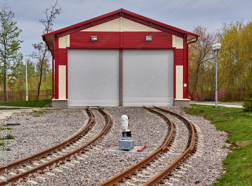 Modern railway depot, garage for narrow gauge locomotives. Sleepers and ...