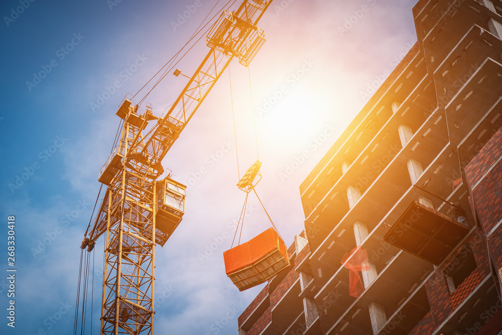 Industrial Crane Works in Construction Site, Developing New Modern ...
