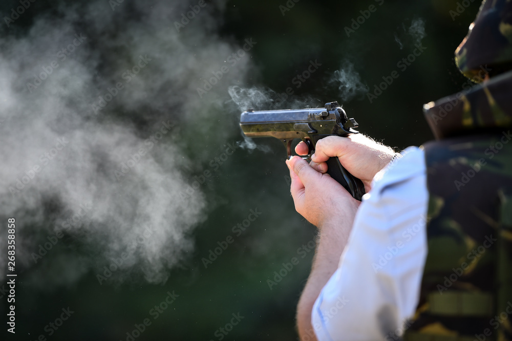 Outdoor target shooting with a 9mm pistol in a shooting range Stock ...