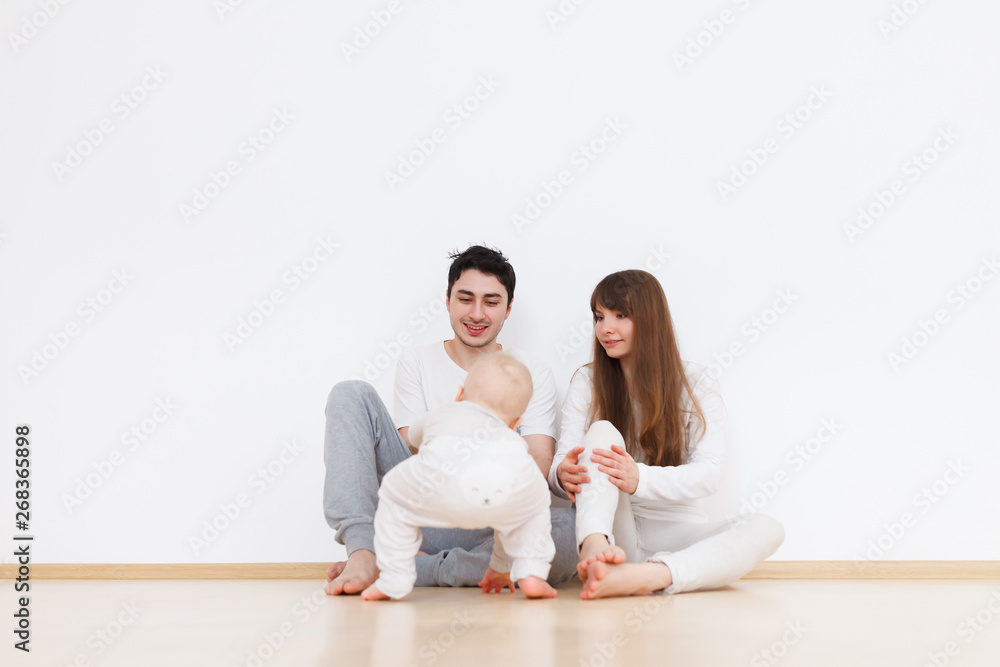 Front side view-Little baby boy one-year old tried made his first step ...