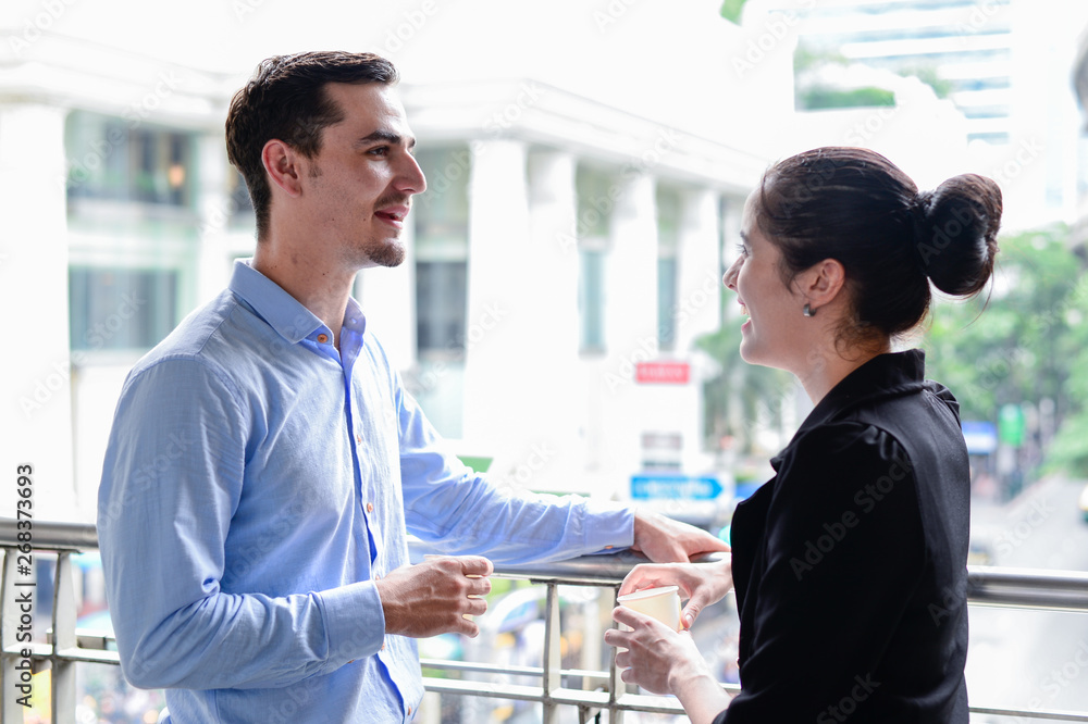 businessman and businesswoman talk about business future in the city ...