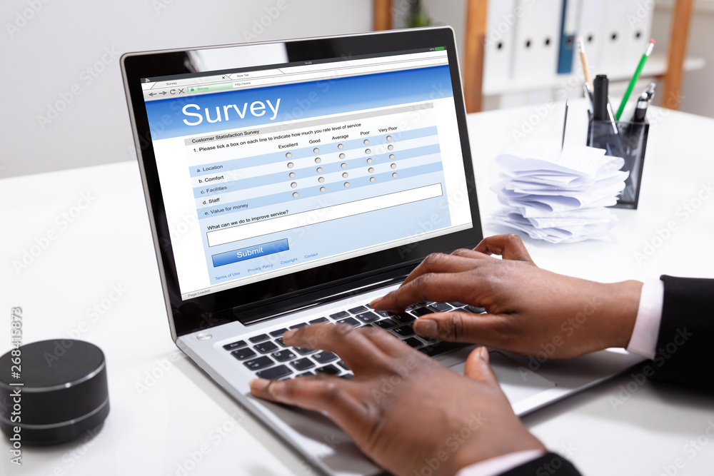 Businesswoman Filling Online Survey Form On Laptop Stock Photo | Adobe ...