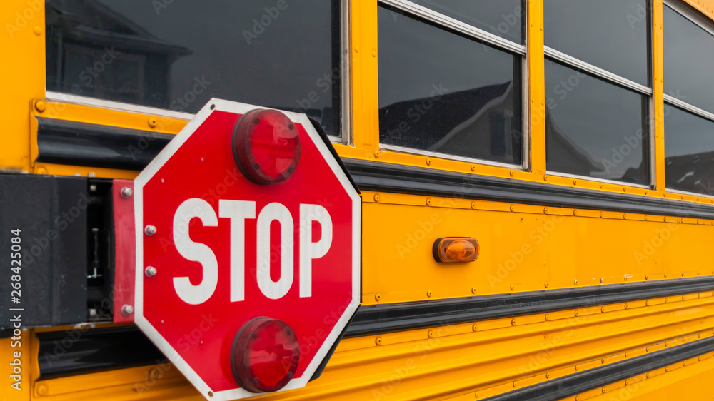 Clear Panorama Exterior view of a yellow school bus with a red stop ...