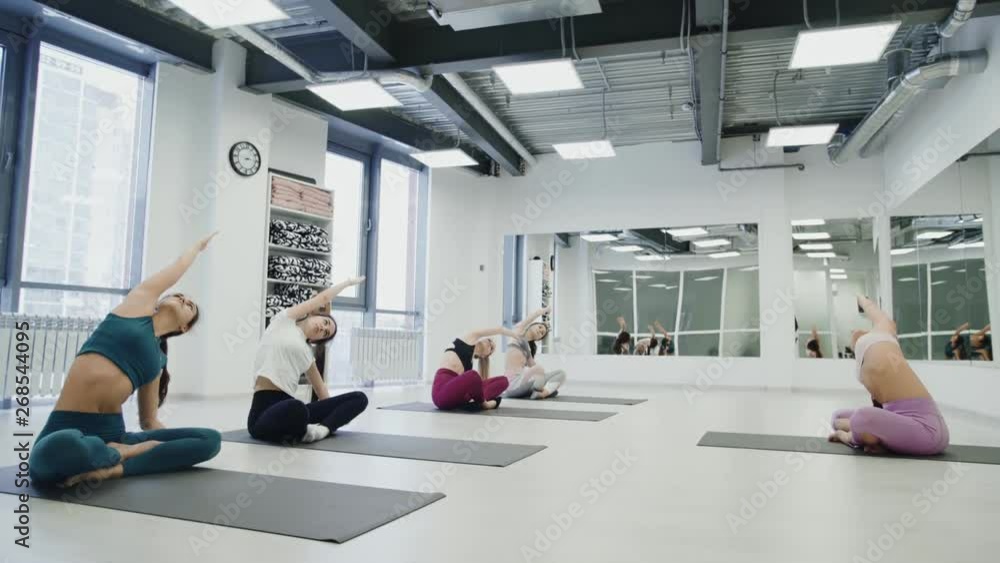 Yoga Practice Exercise Class Concept. Trainer shows exercises Stock ...