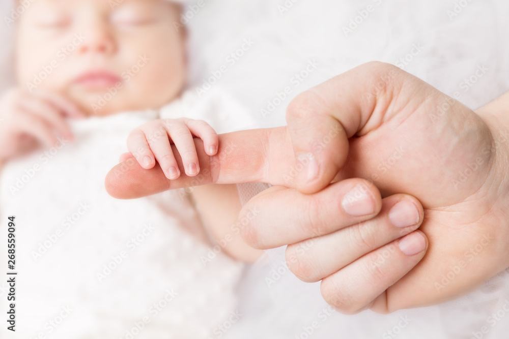 Newborn Baby Holding Mother Hand, Mom Finger and New Born Kid on White ...