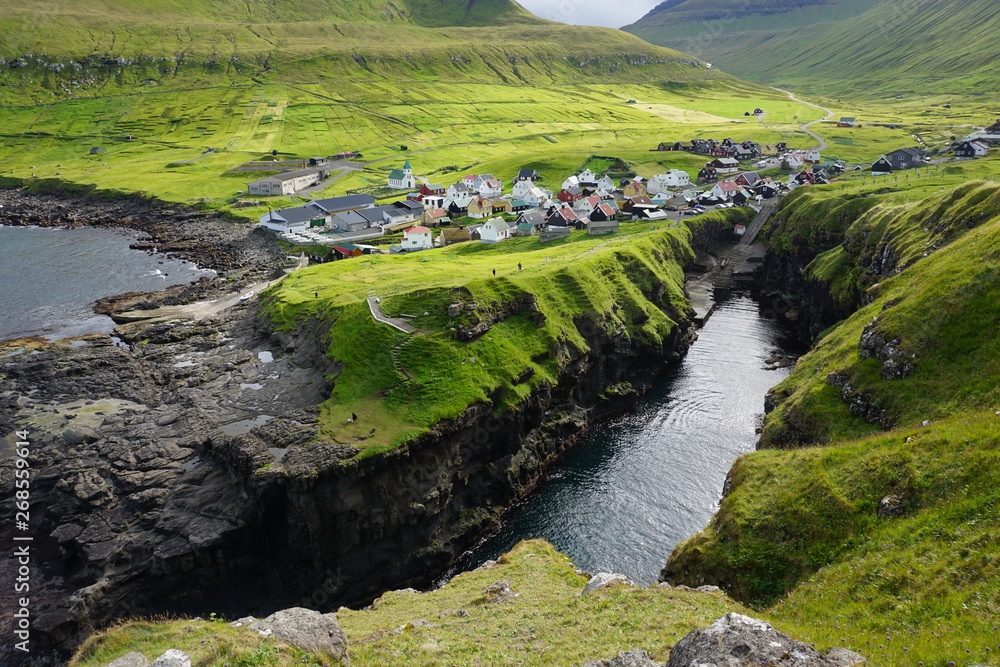 Faeroe Islands with beautiful nature, green grasslands, sea, rocks and ...