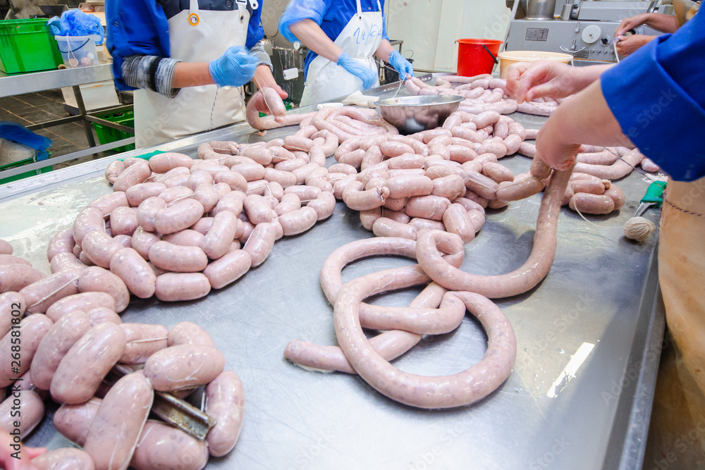 Foto de Sausage. Sausage production line. Process of sausage ...