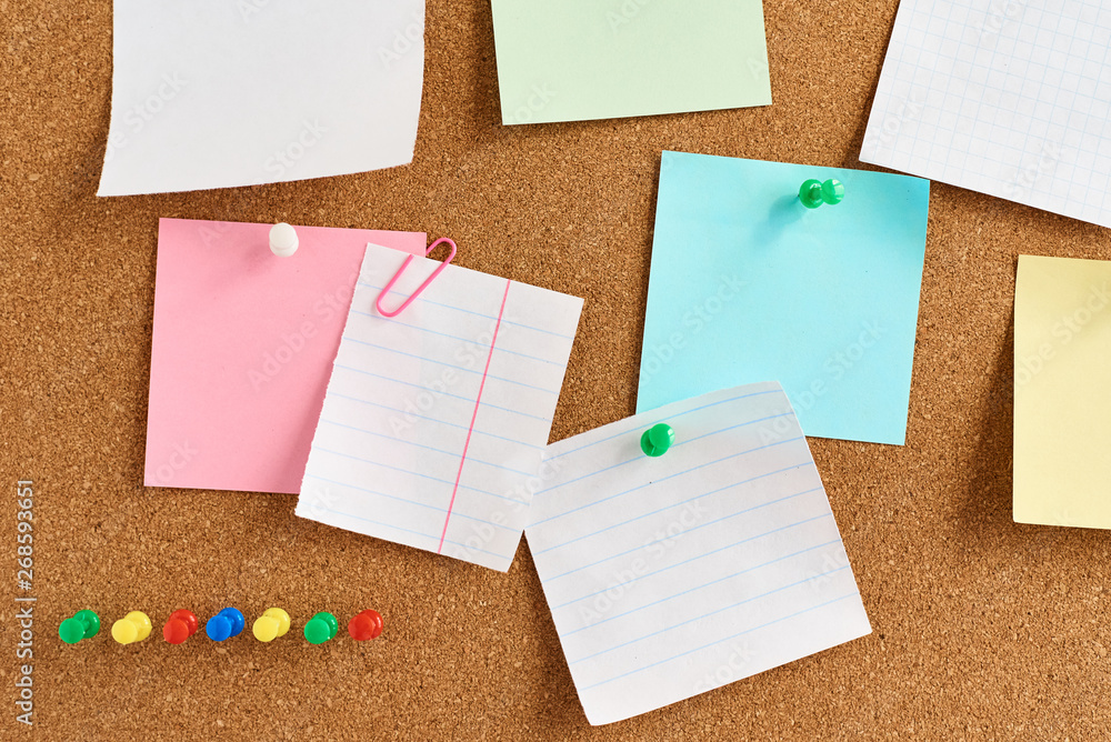 Cork board with pinned colored stickers Stock Photo | Adobe Stock
