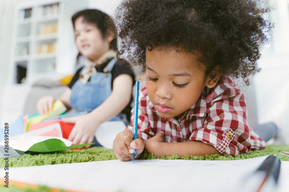 Group of little preschool kids drawing paper with color pencils ...