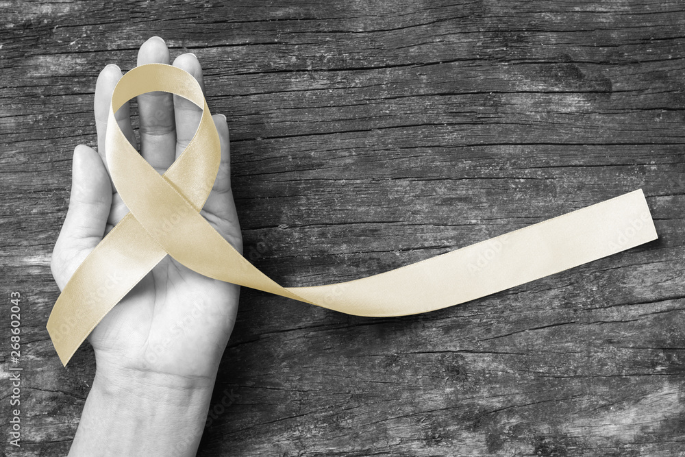 Cream awareness ribbon on helping hand support symbolic bow color for ...