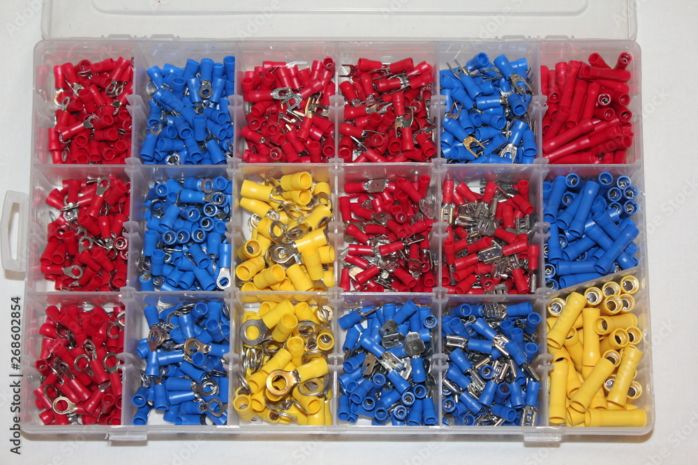 cable lugs with differents colours and sizes on a white background, for ...