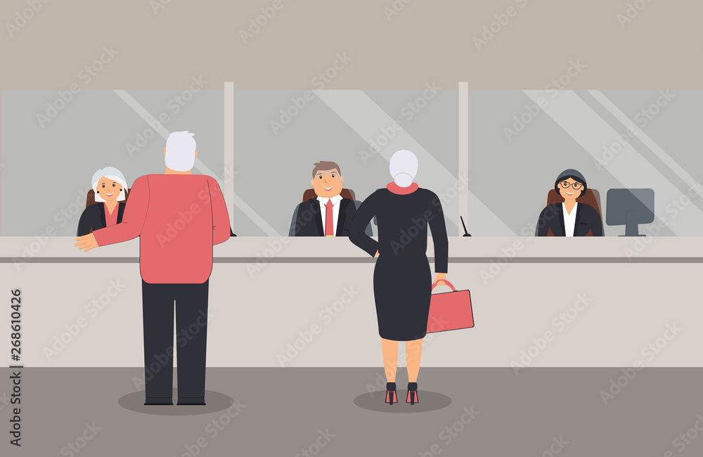 Bank office interior:Bank employees sit behind a barrier with glass and ...