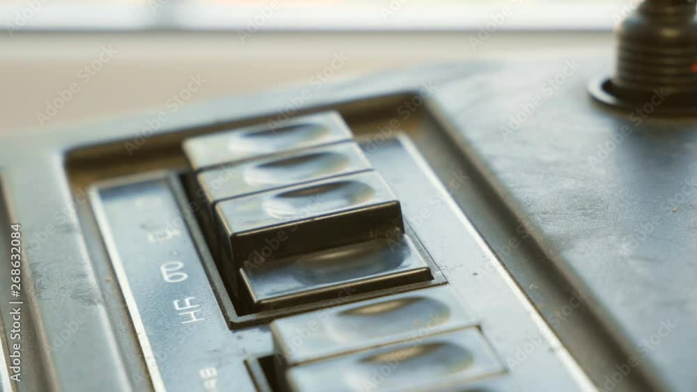 Press a button on a vintage tape recorder. Close-up. A man presses ...
